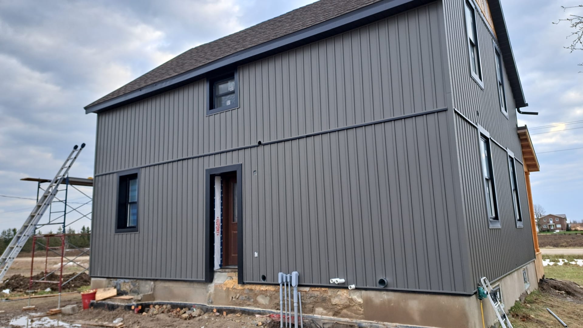 Modern vertical siding installation showcasing contemporary design